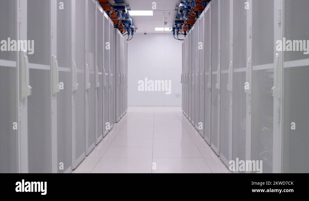 4K Empty interior of large modern data centre with rows of server racks ...