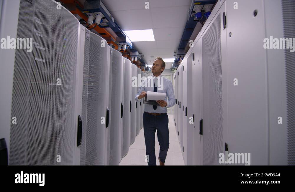 4K Group of computer technicians checking machines in a data center ...