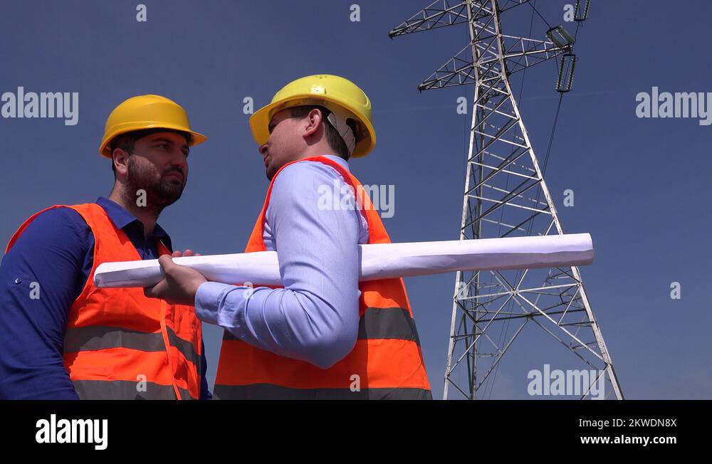 Electric tower distribution foreman engineer men talking supervise ...