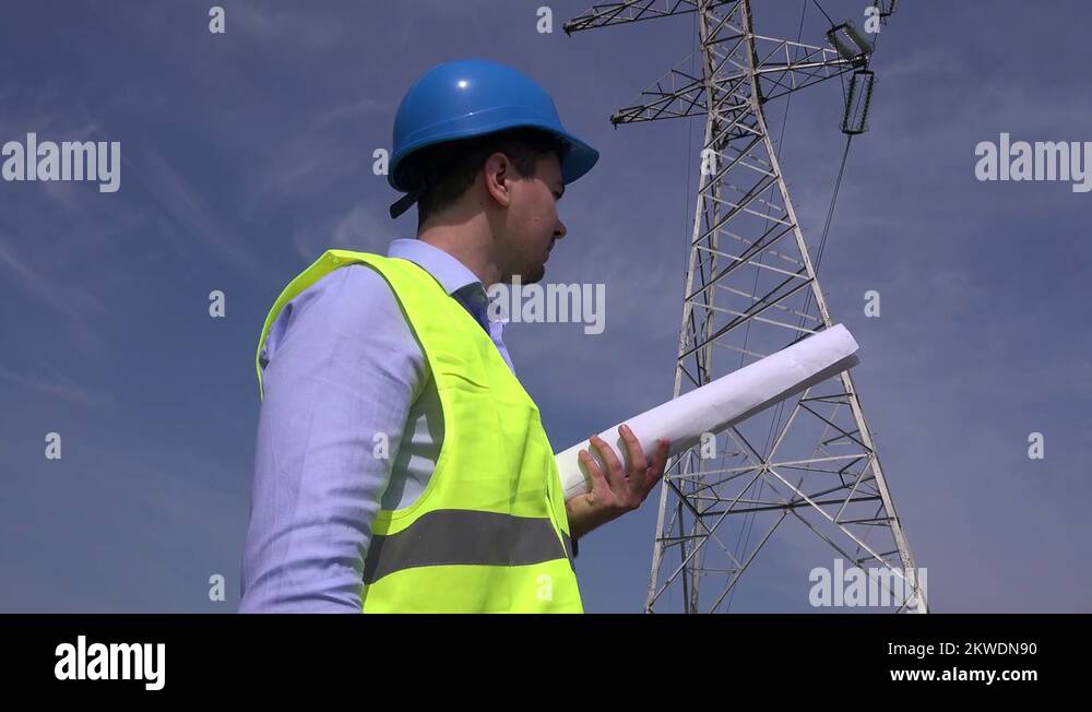 Foreman with electricity green energy development plan blueprints ...