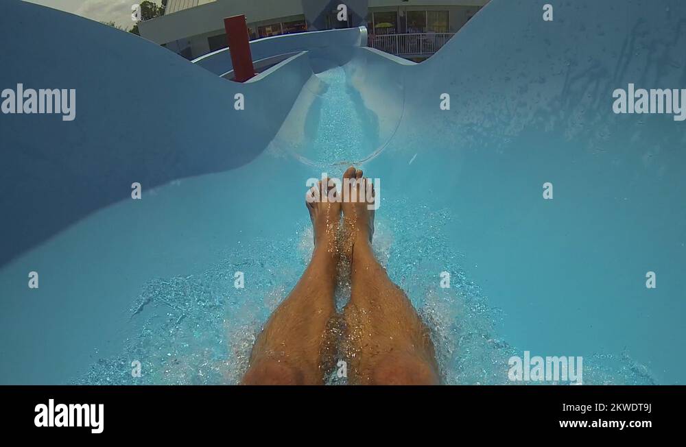 Water park Sliding down the waterslide water slides in pool at indoor ...
