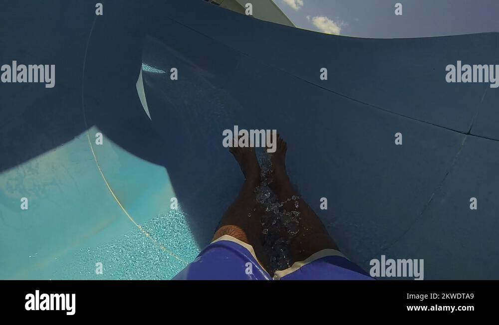 Water park Sliding down the waterslide water slides in pool at indoor ...