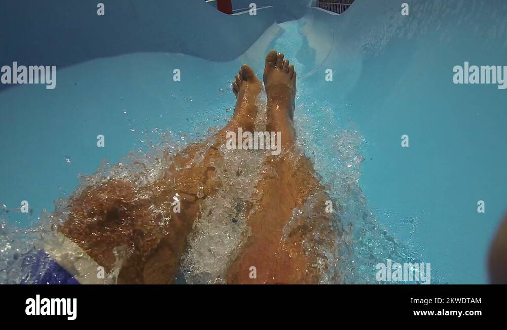 Water park Sliding down the waterslide water slides in pool at indoor ...