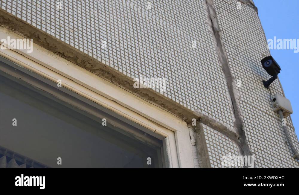 CCTV camera located on the wall of the school building Stock Video ...