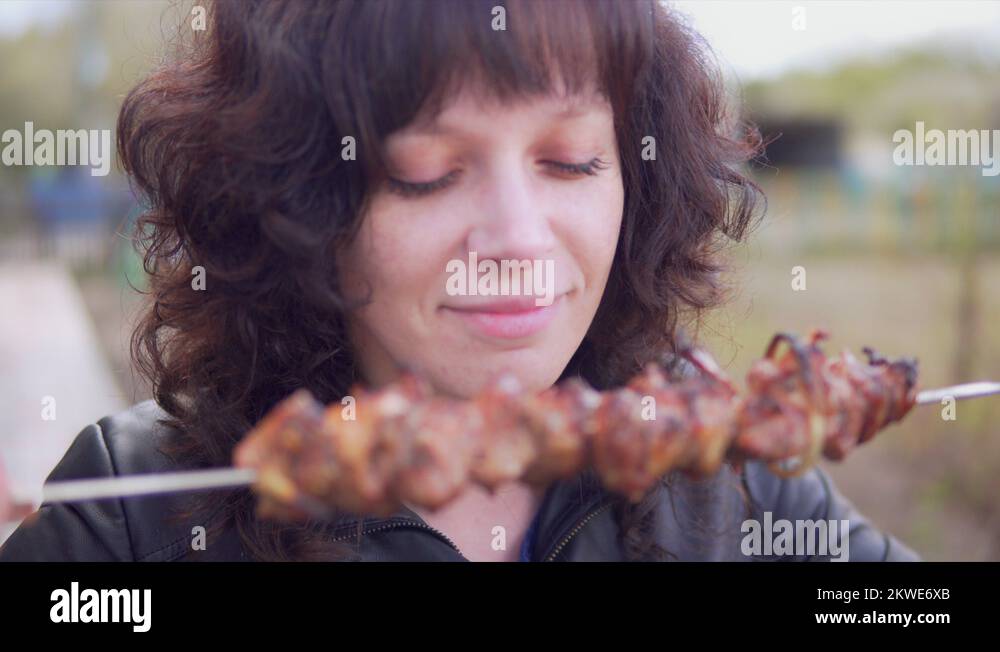 Woman eating at barbecue Stock Videos & Footage - HD and 4K Video Clips ...