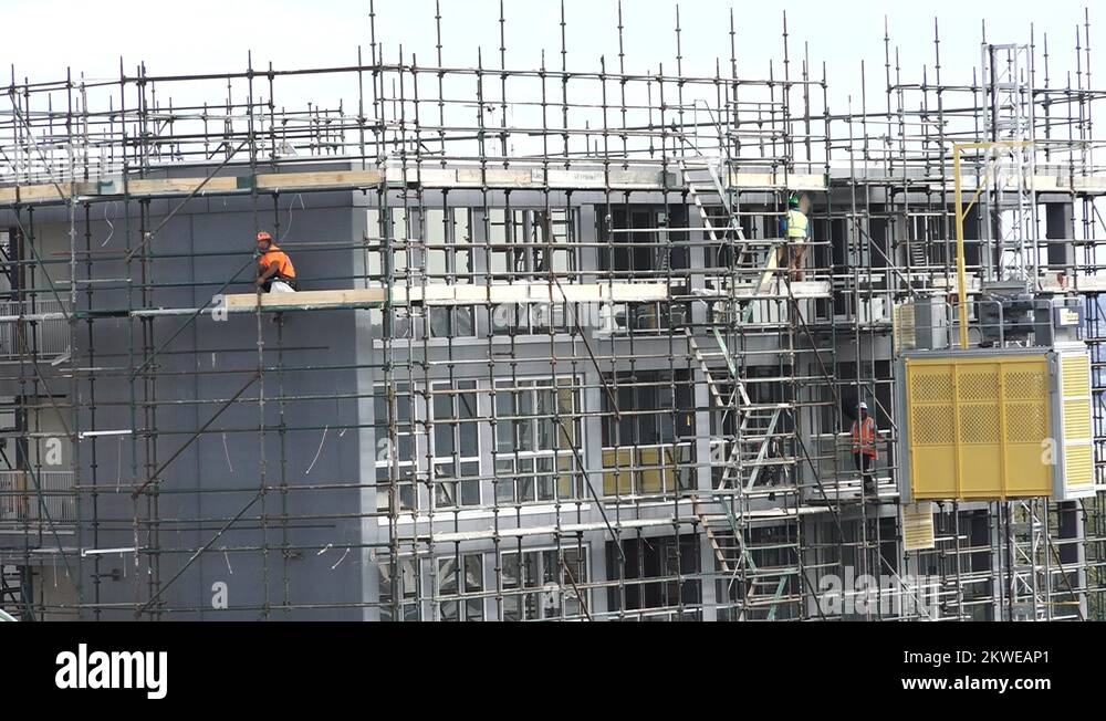 Construction workers on a scaffold Stock Videos & Footage - HD and 4K ...