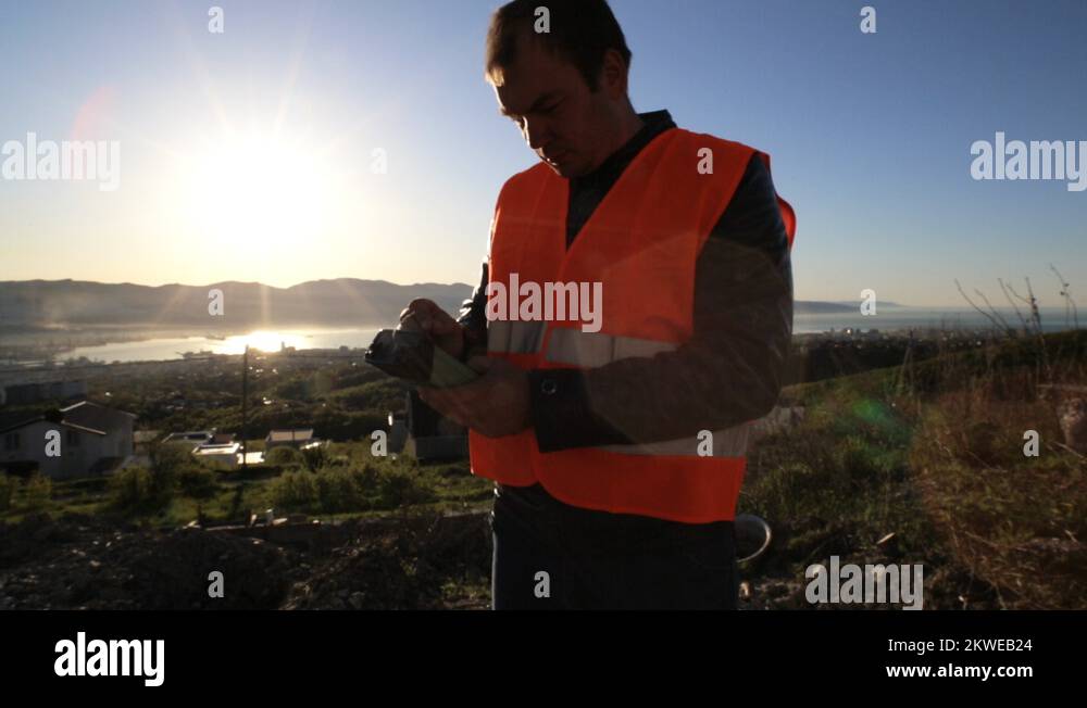 Surveyor performing geodesic measurements on top of the mountain Stock ...