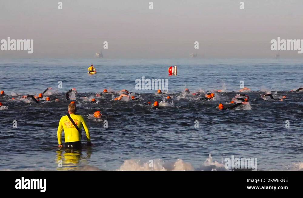 Triathlon swimmers swim in the ocean Stock Video Footage - Alamy
