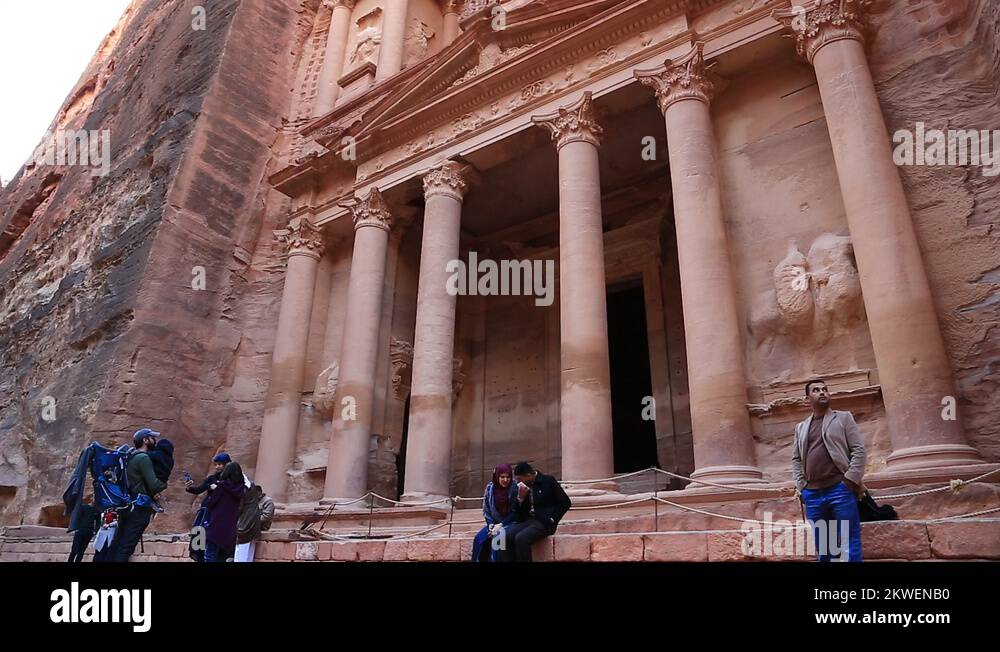 People near Al Khazneh or the Treasury at ancient Rose City of Petra in ...