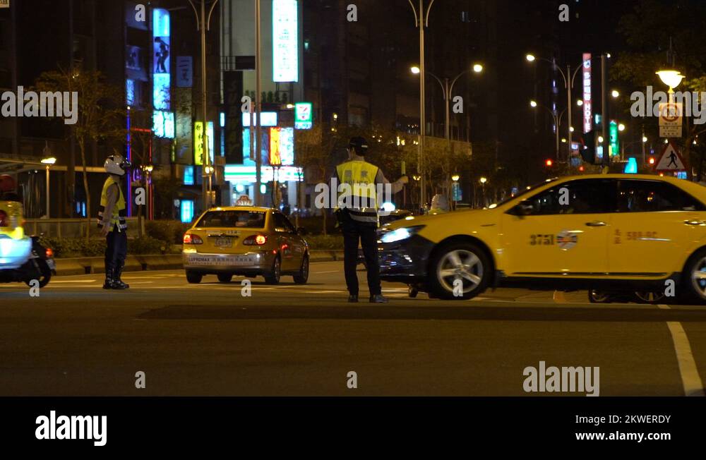 Slow motion police officer regulates movement cars used flashing light ...