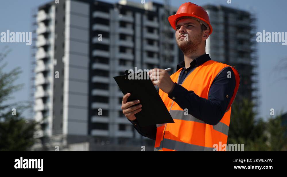 Engineer Man Taking Notes Activity Construction Site on Clip Board ...