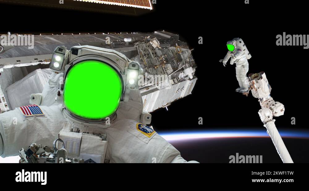 Green Screen Astronaut Spacewalk Working on Space Station on Robotic ...