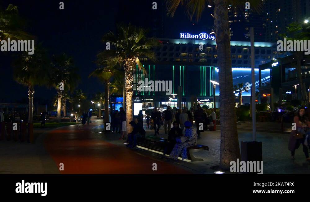 night illuminated dubai marina famous walk bay hilton hotel panorama 4k ...