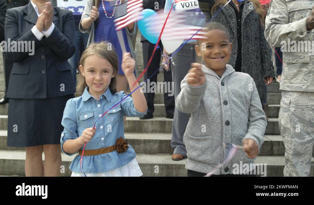 A crowd clapping and applauding in front of a building Stock Video ...