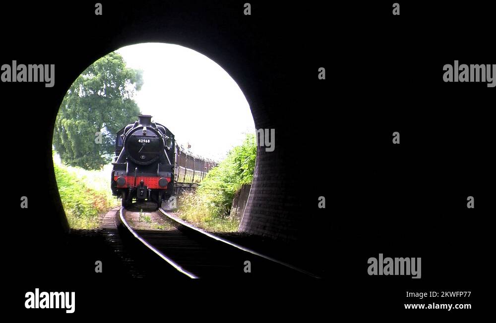 Steam train entering tunnel, JVC GY-HM100E Stock Video Footage - Alamy