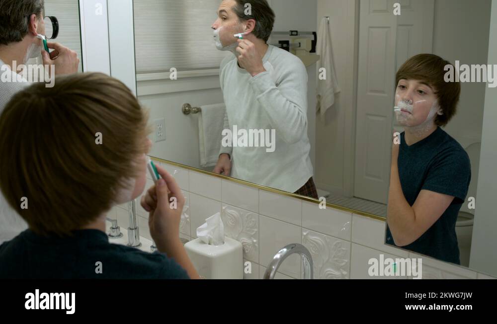 Son imitating father Stock Videos & Footage - HD and 4K Video Clips - Alamy