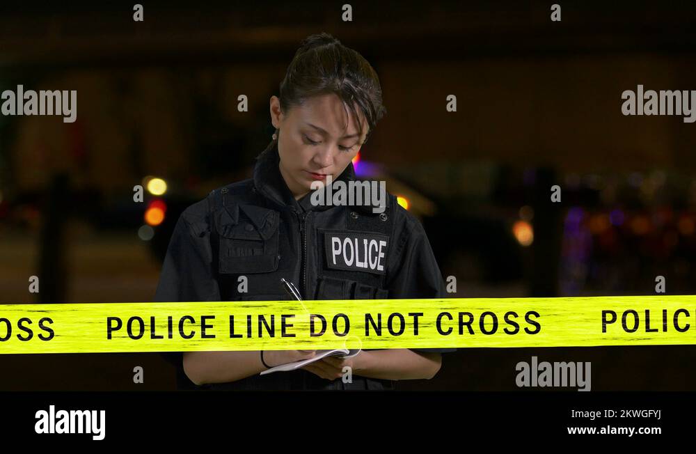 Asian female police officer using radio Stock Video Footage - Alamy