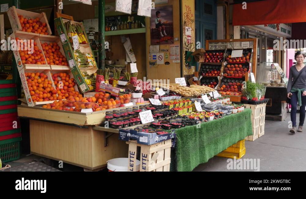 Fruits and berries layout on a street food shop entrance in Montmartre ...