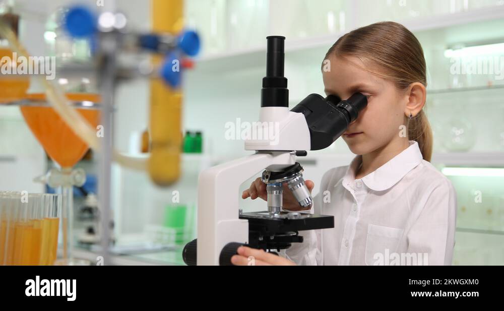 Child Using Microscope in School Chemistry Lab, Student Studying ...
