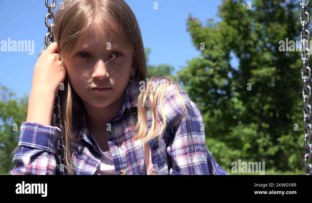 Sad Pensive Child in Swing, Unhappy Girl Playing Alone Outdoor ...
