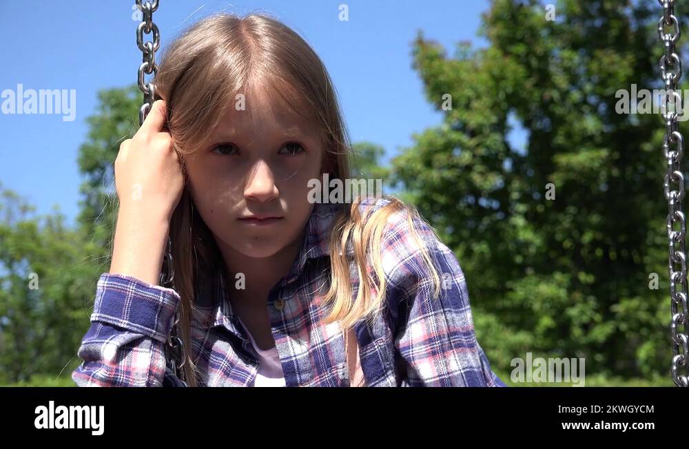 Sad Pensive Child in Swing, Unhappy Girl Playing Alone Outdoor ...