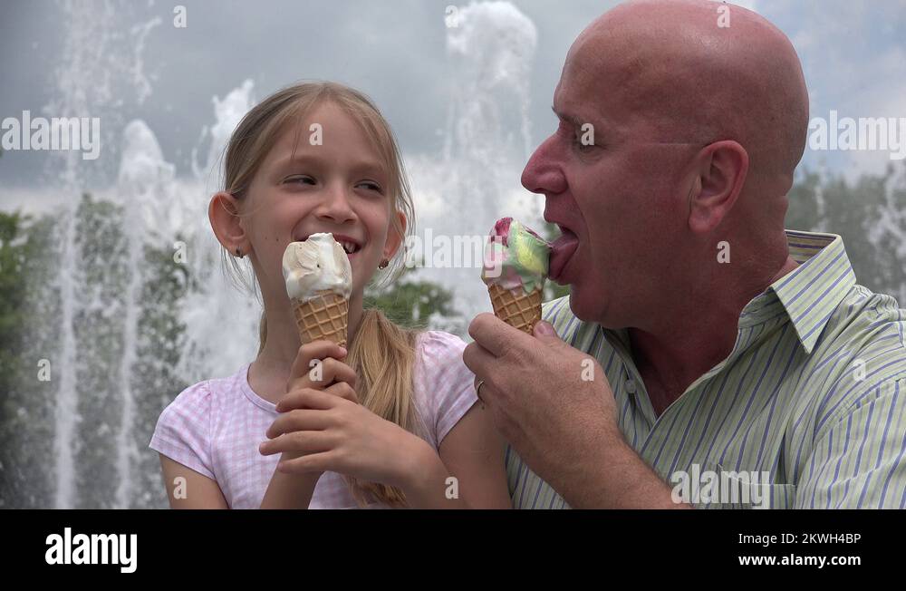 Child Eating Ice Cream with Father in Park, Family Relaxing Outdoor ...