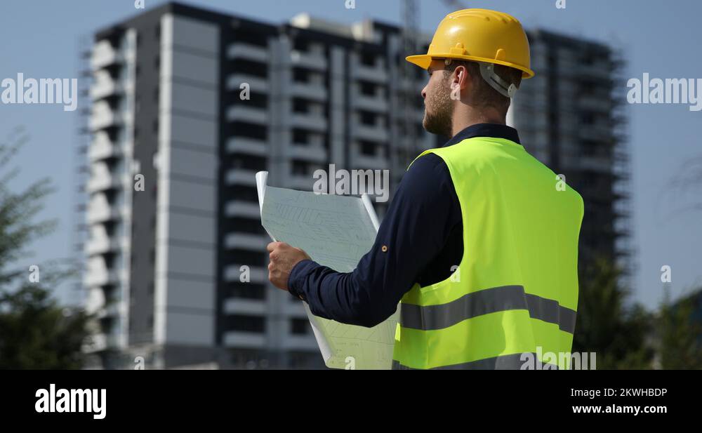 Under Construction Site Employee Engineer Man Looking Up Analyzing a ...
