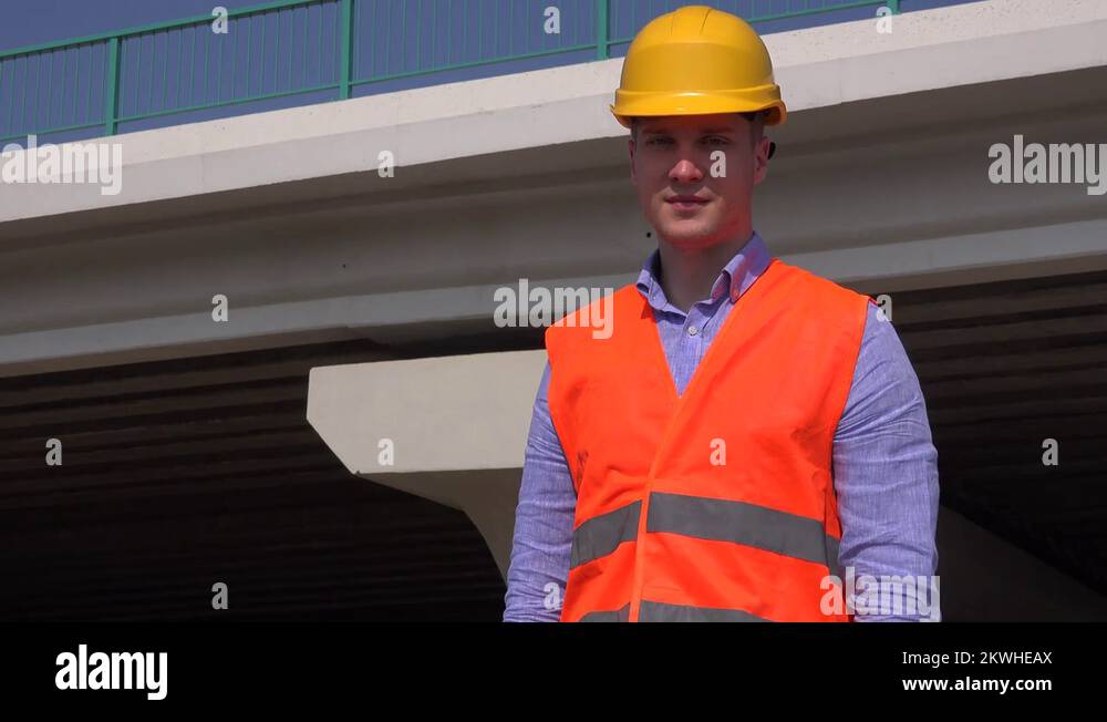 Thumbs up successful builder constructor at bridge construction site ...