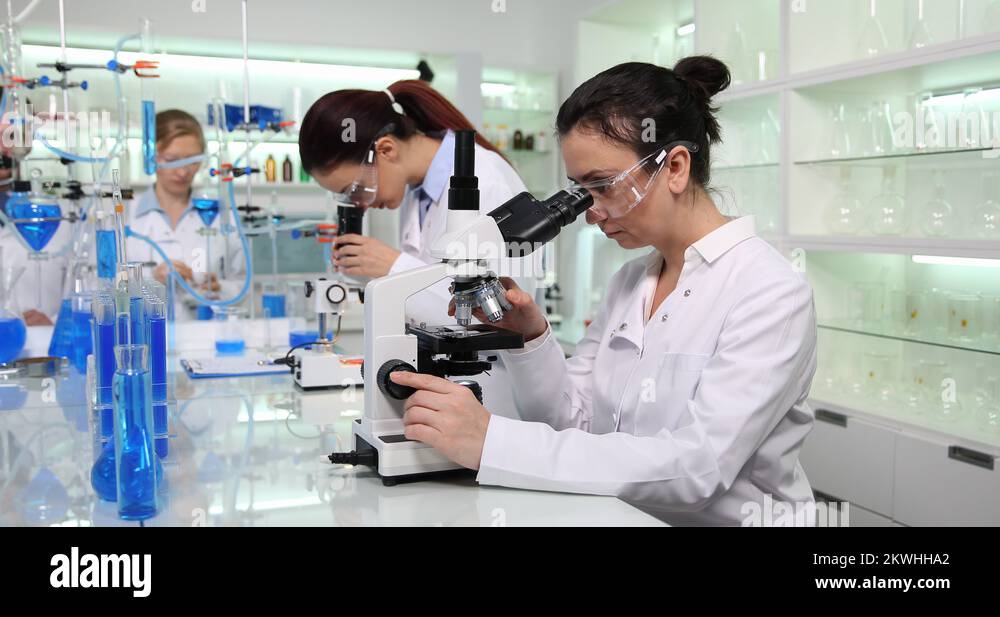 Team of Experts Working on Microscope Laboratory Conversation Research ...