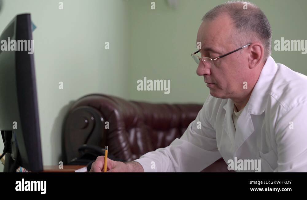 Dentist Records The Diagnosis by Looking at X-Ray of the Tooth of the ...