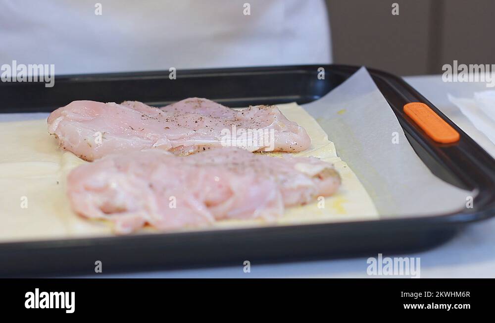 Female Chef's hands Baking pies of puff pastry with chicken breast ...