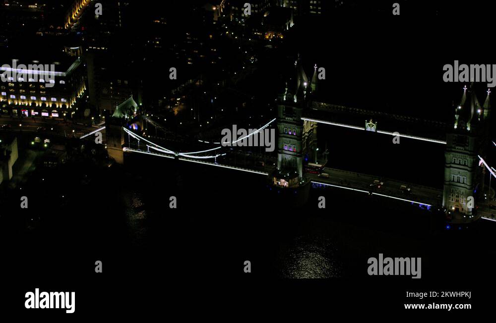 4K Aerial view of traffic crossing London's iconic Tower Bridge at ...