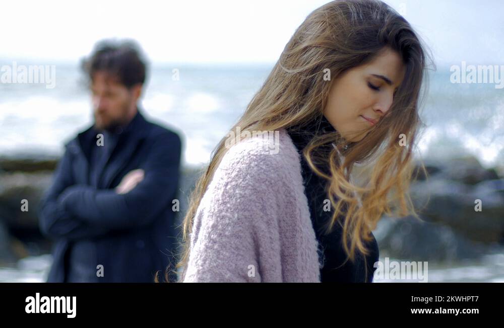 Sad woman in silence after fight with boyfriend in front of ocean in ...