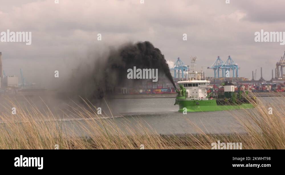 dredging operation of hopper dredger Reynaert, rainbowing black mud ...