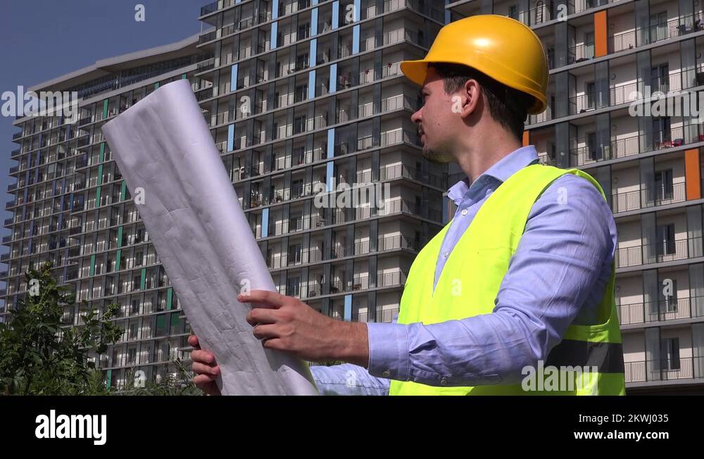 Architect inspector reading blueprints modern real estate home ...