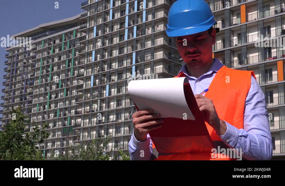Supervisor inspection man at construction area thoughtful writing notes ...