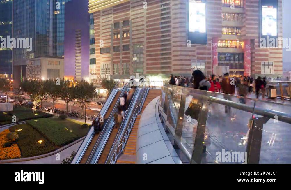 Circular pedestrian walkway with Flags flying above a traffic ...