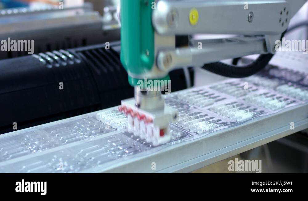 Packaging line at pharmaceutical plant. Pharmaceutical manufacturing ...