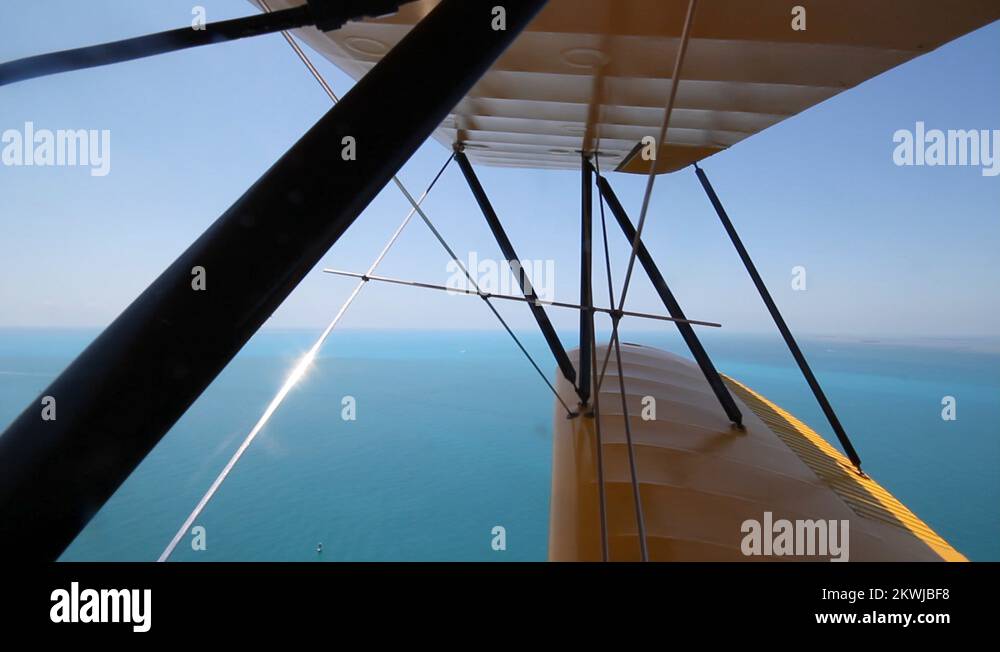 Biplane over ocean. Two shots Stock Video Footage - Alamy