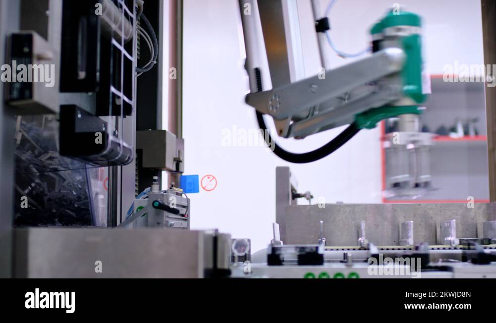 Pharmaceutical production line. Robotic arm of packaging machine Stock ...