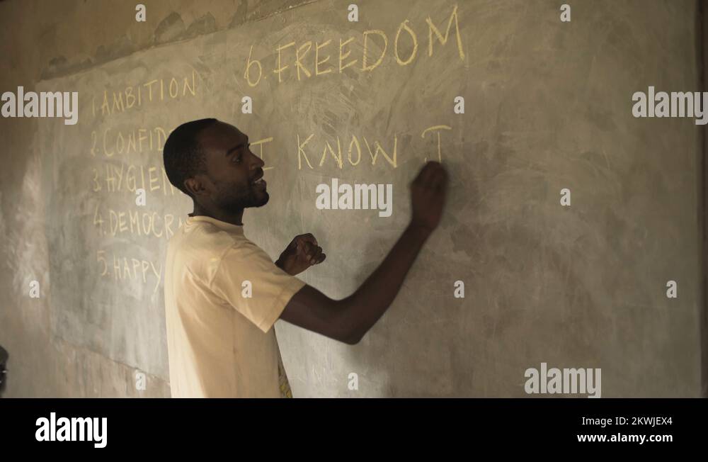 African teacher writing on chalkboard Stock Videos & Footage - HD and ...