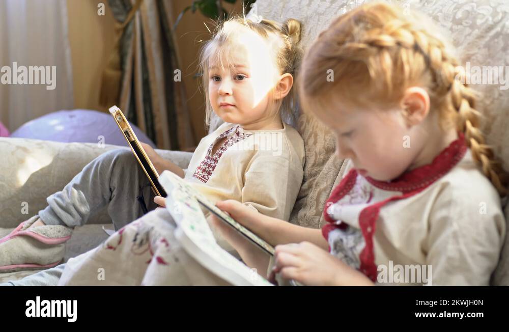 Slavic Children Playing on Tablets at Home Stock Video Footage - Alamy