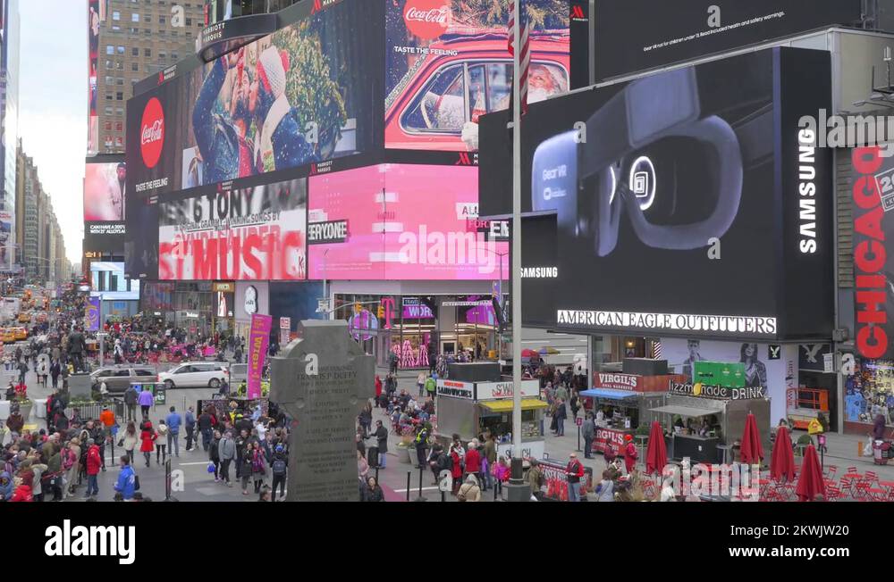 Digital screens and billboards at crowded Times Square New York City ...
