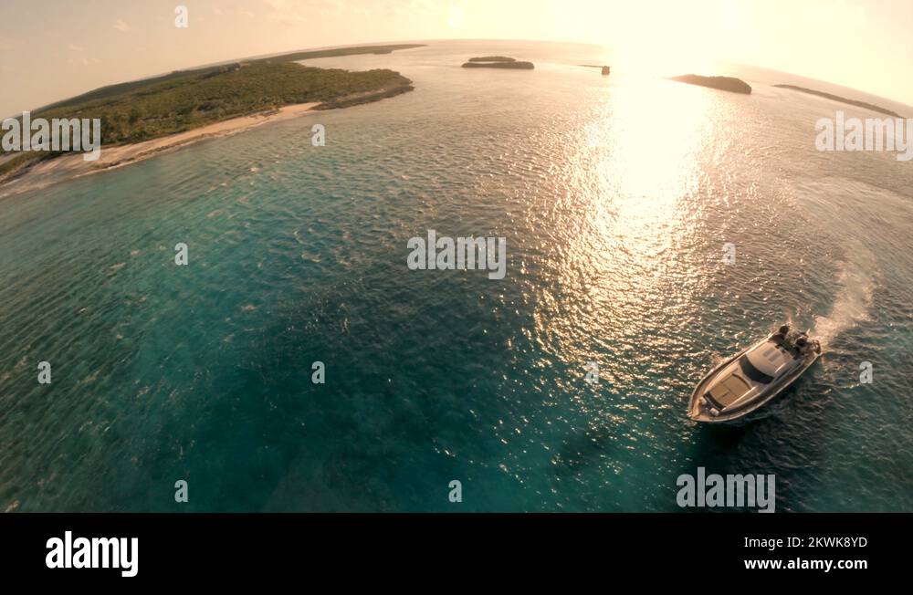 Birds eye view high above a luxury yacht and reef. Bahamas. Exumas ...