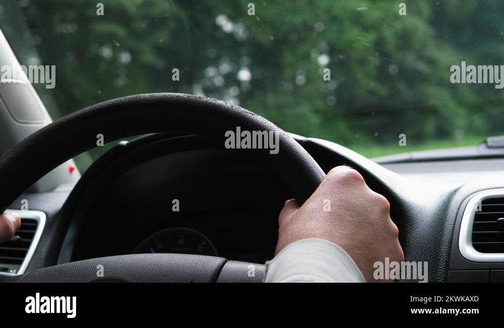 Man driving car on road. Shallow depth of field. Slow motion 4k UHD ...