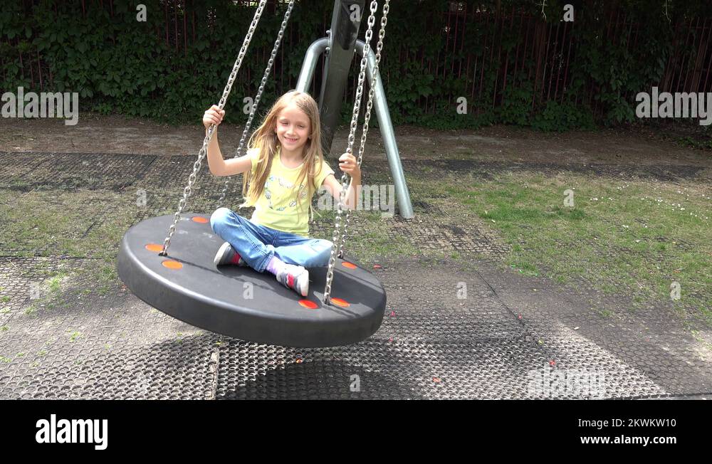 Happy Smiley Girl Swinging Outdoor, Child Playing at Playground Park ...