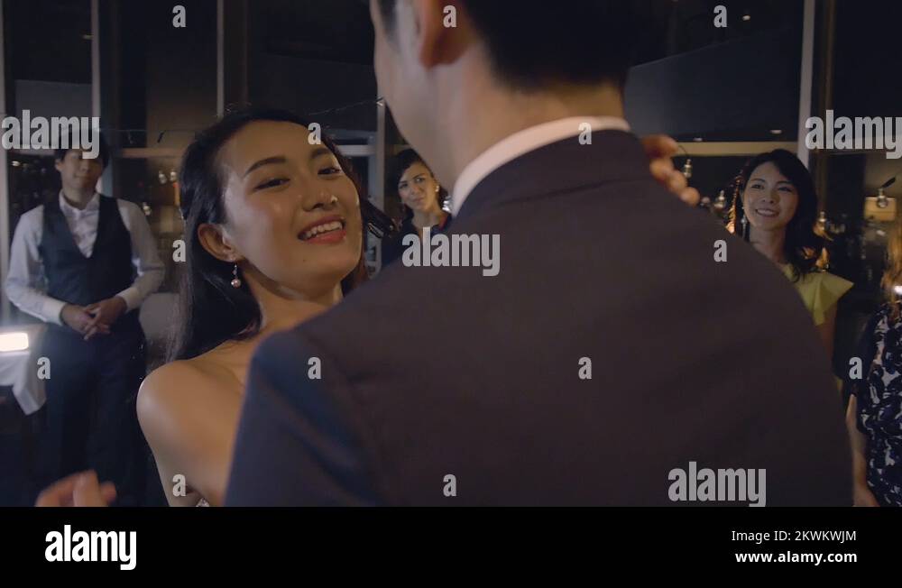 Beautiful Japanese couple dancing at their wedding steadycam shot Stock ...