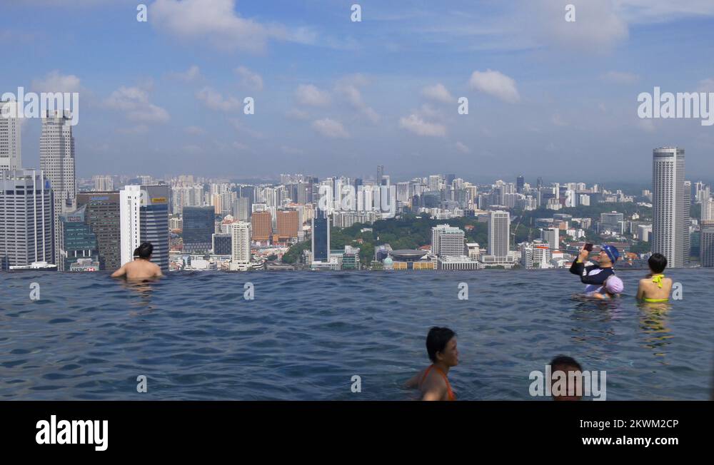 summer day singapore famous hotel rooftop crowded pool cityscape ...