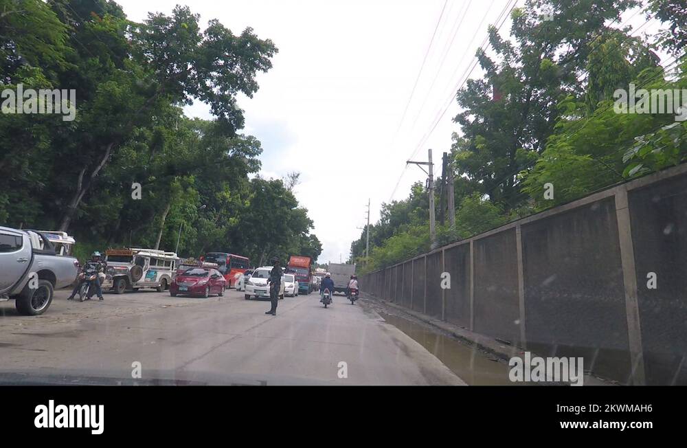 Cars lined up at a checkpoint in The Philippines Stock Video Footage ...