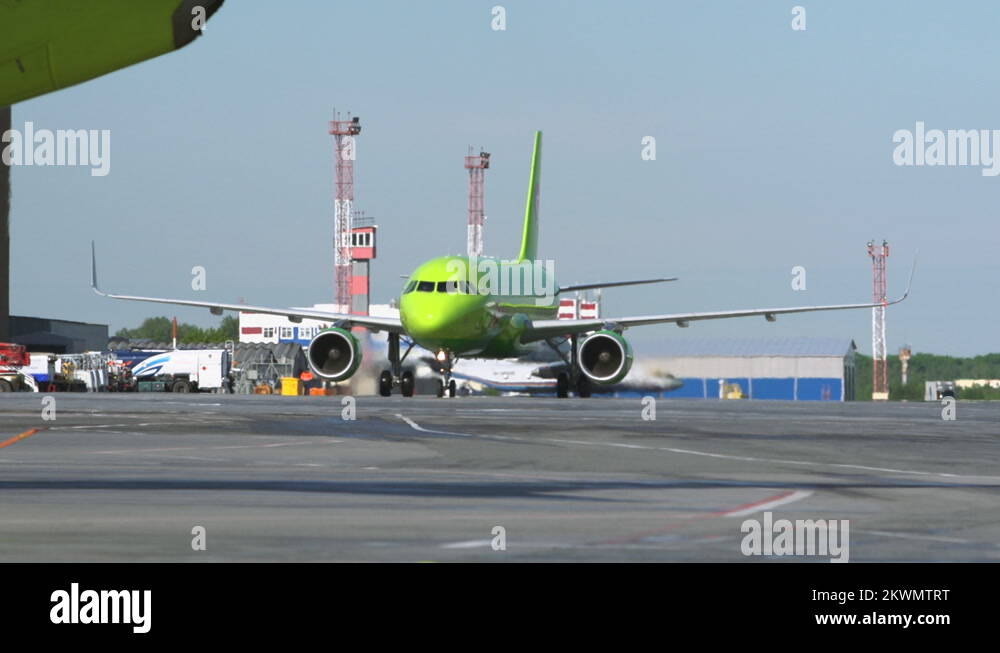 Airplane moves along runway. Airline S7 Stock Video Footage - Alamy